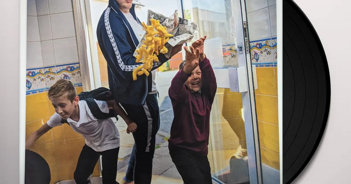 The Reytons WHAT'S ROCK & ROLL? (MILK COLOURED PRINTED VINYL) Vinyl Record